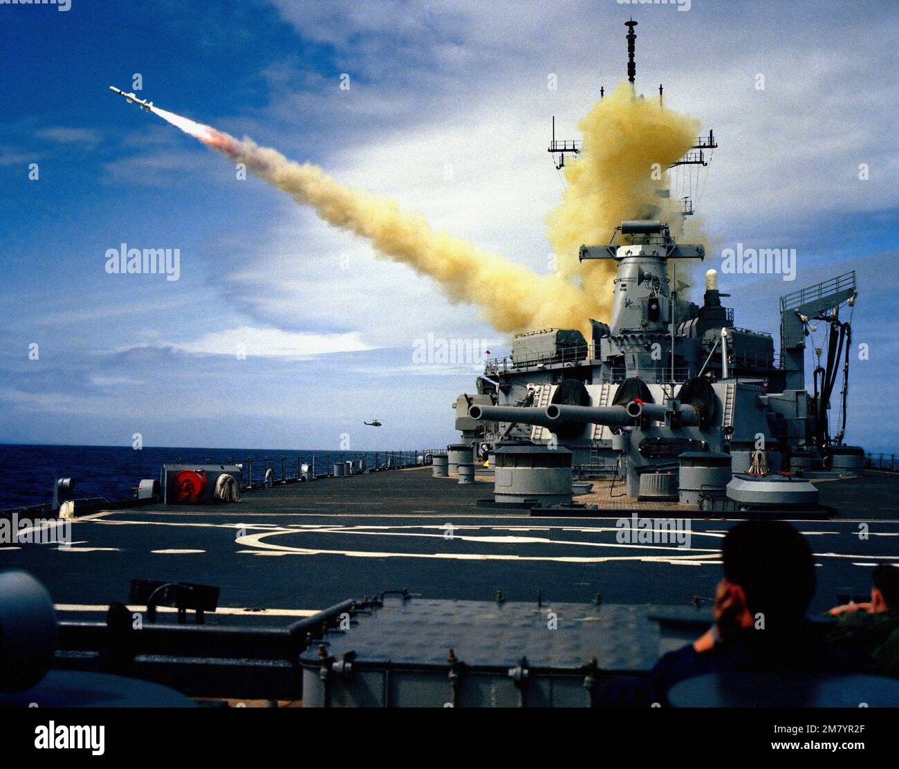 A Harpoon (RGM-84A) missile is launched from the battleship USS NEW ...
