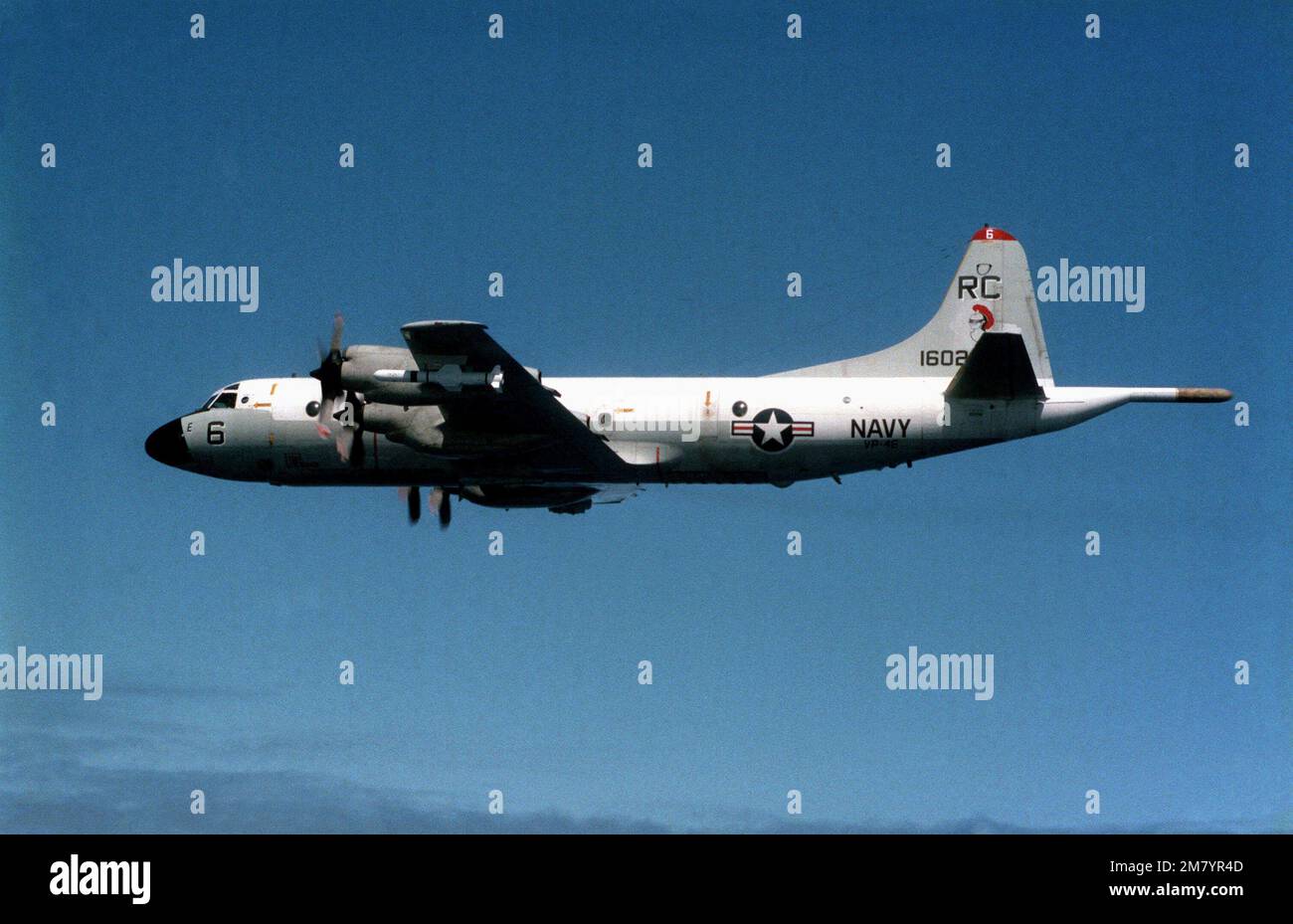 An air-to-air left side view of a P-3C Orion aircraft with an AGM-84A ...