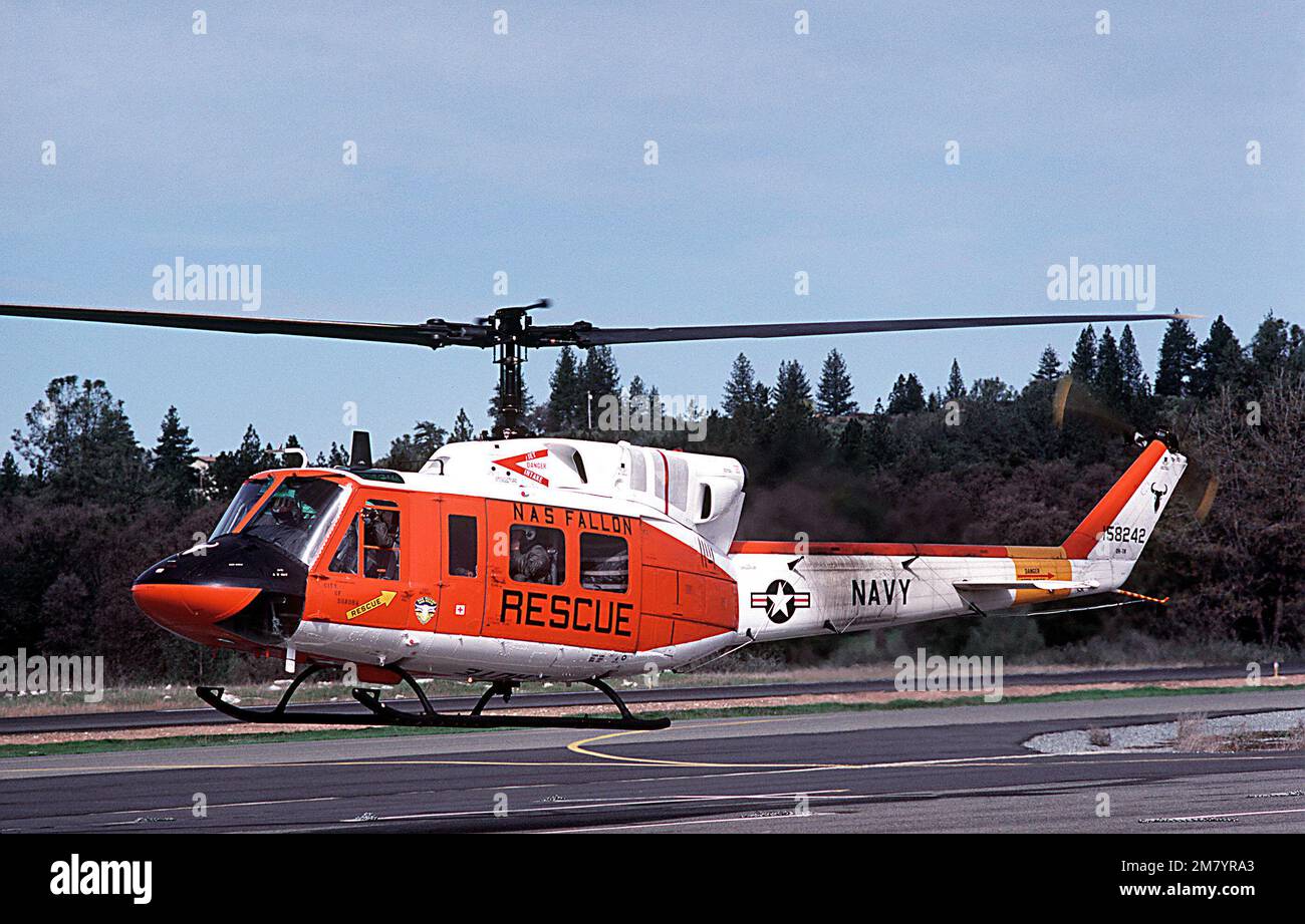 A left side view of a Search and Rescue (SAR) UH-1N Iroquois helicopter ...