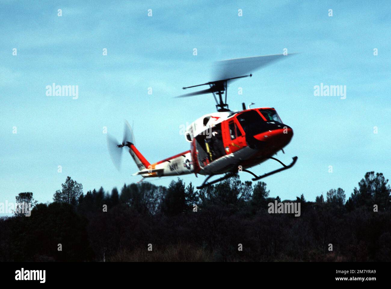 A right front underside view from a Search and Rescue (SAR) UH-1N ...