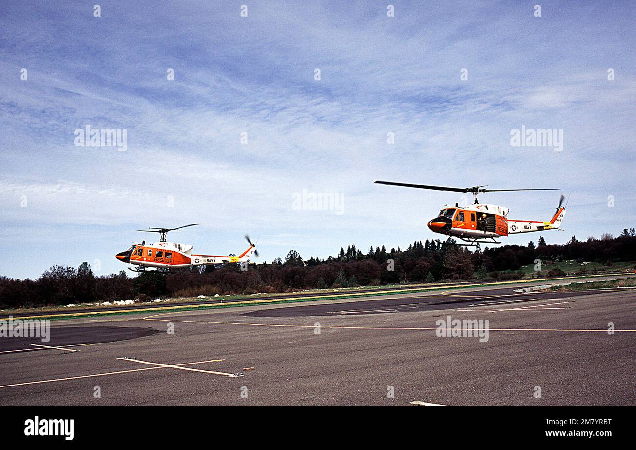 A left front view of two Search and Rescue (SAR) UH-1N Iroquois ...