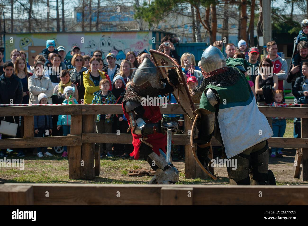 Barnaul - April 22, 2017: Medieval restorers fight with swords in armor ...