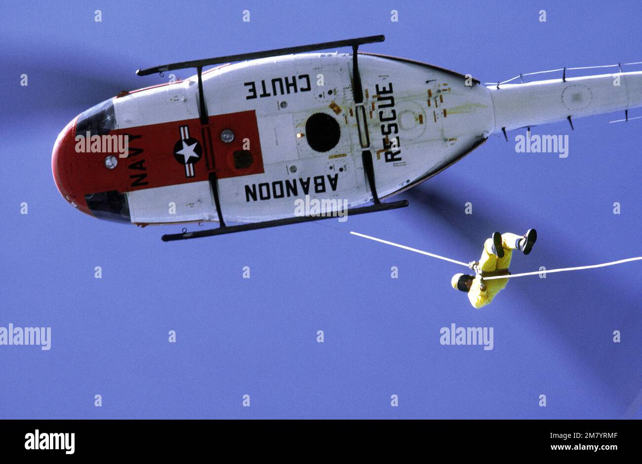A vertical view, looking up, of a Search and Rescue (SAR) UH-1N ...