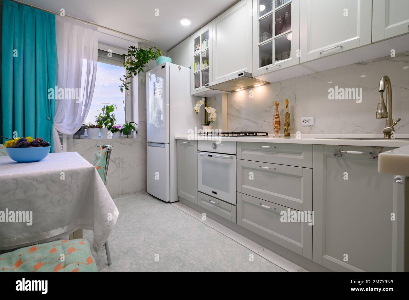 New light grey modern well designed kitchen interior Stock Photo - Alamy