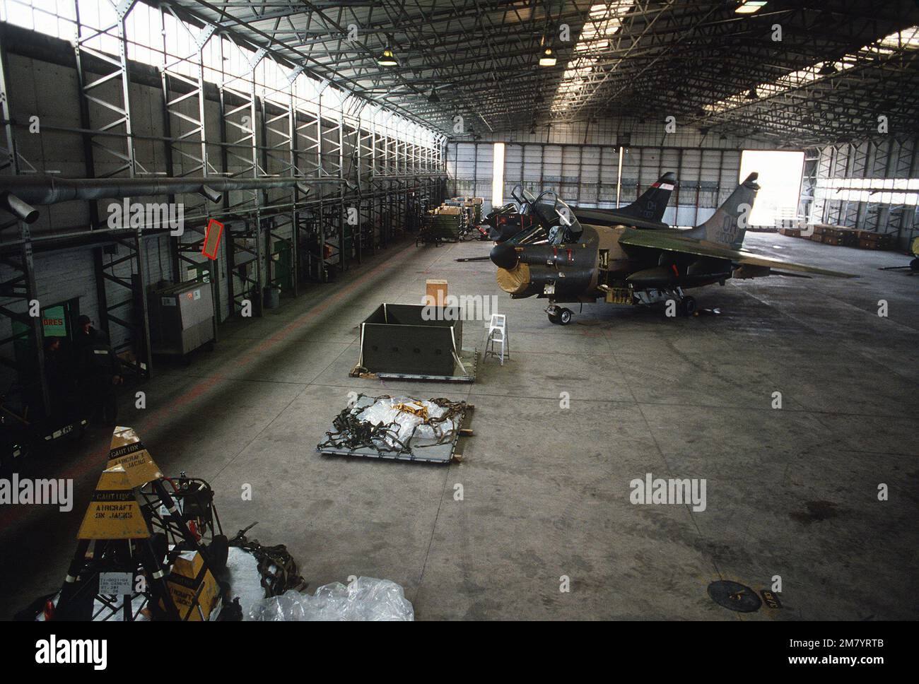 Two A-7D Corsair II aircraft inside the maintenance hangar during ...