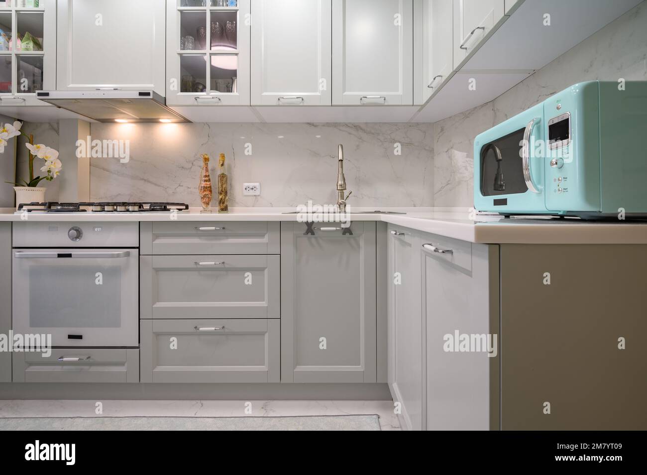 New light grey modern well designed kitchen interior, front view Stock ...