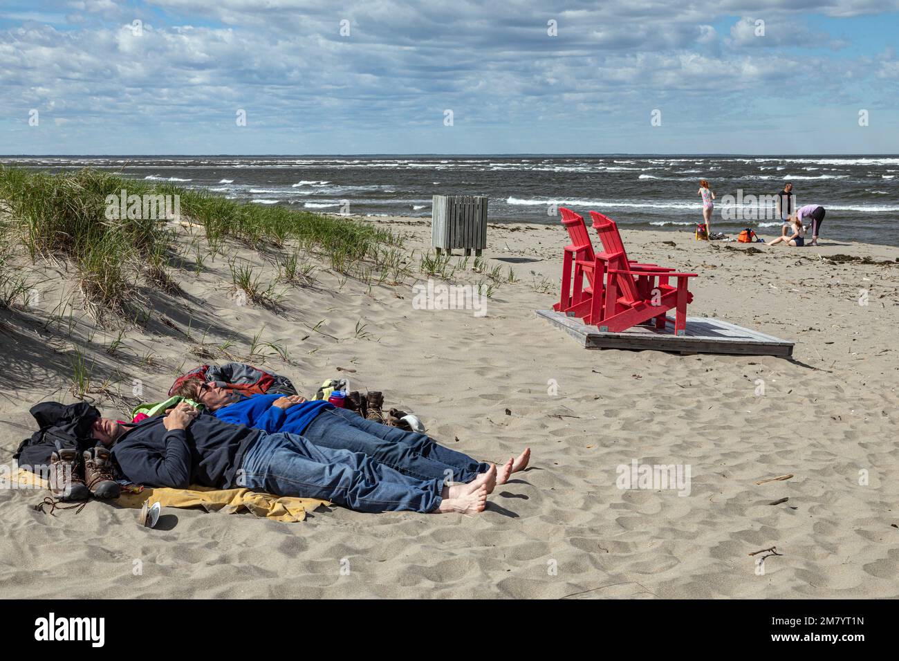 RED BEACH CHAIR ON THE BEACH OF SAINT LOUIS LAGOON, KOUCHIBOUGUAC ...