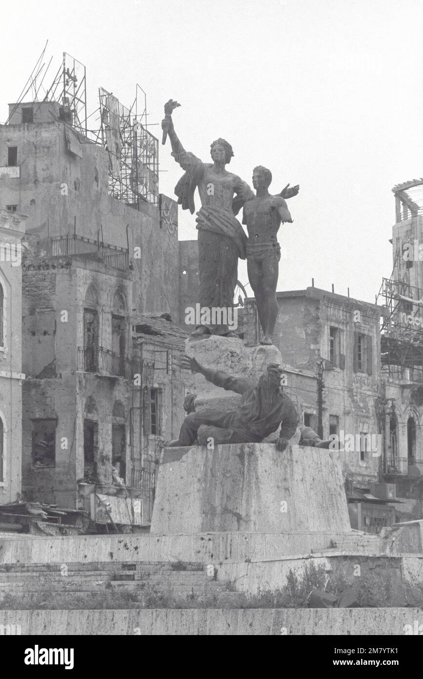 Statues remain standing against a backdrop of bomb destroyed buildings ...