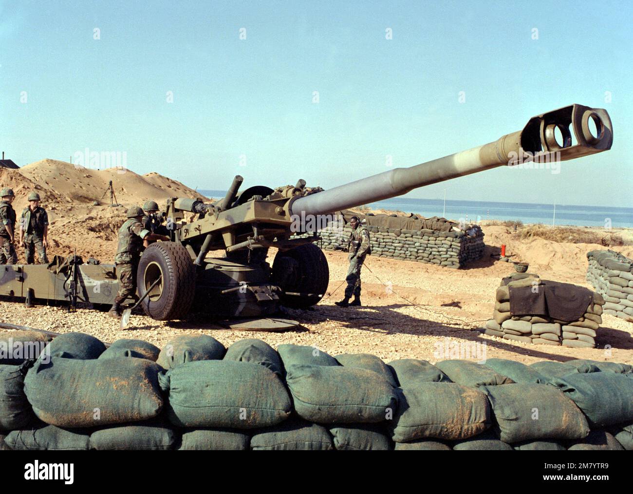 An M-198 155mm howitzer protects a U.S. Marine Corps encampment near ...
