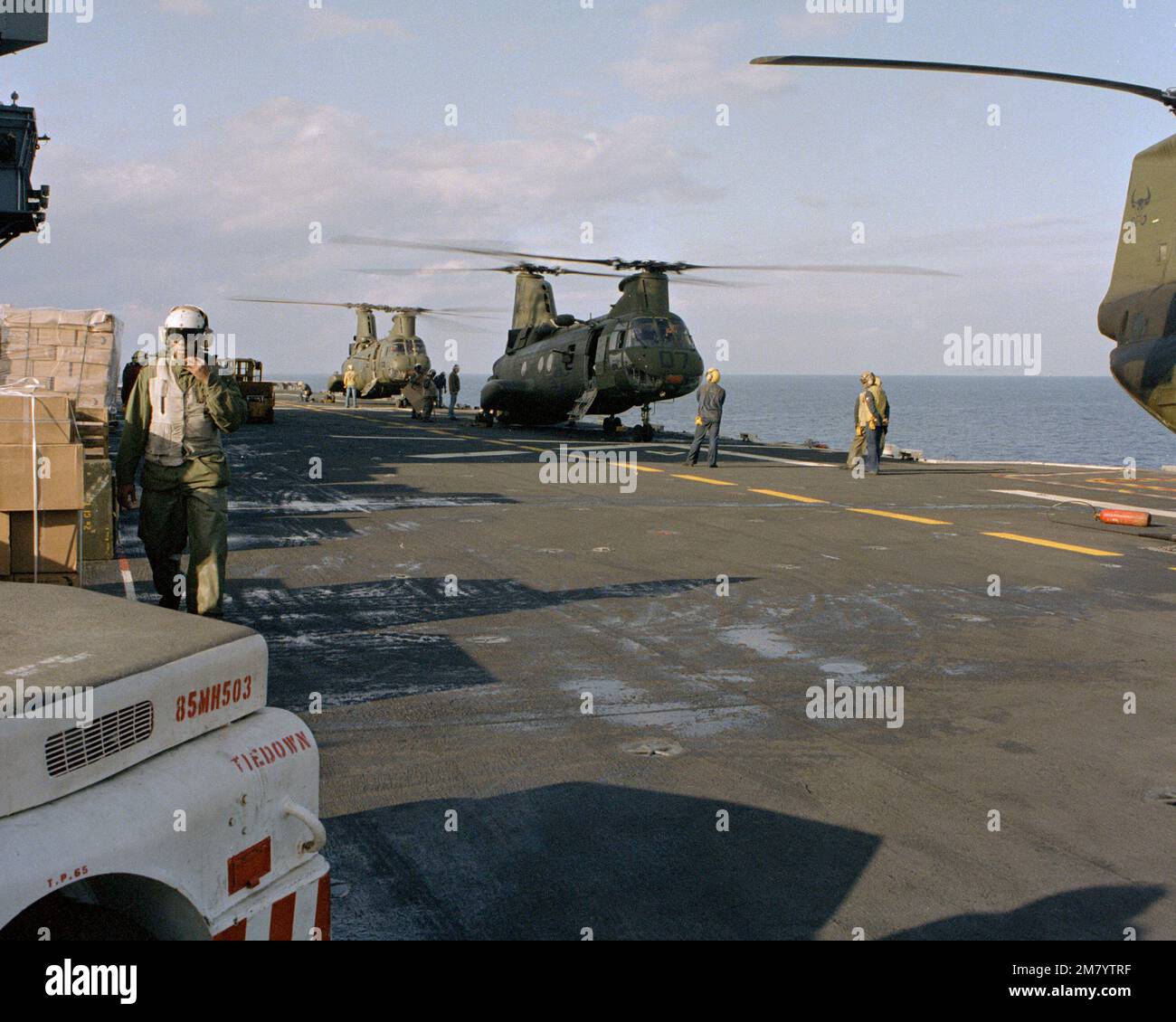 A view of CH-46 Sea Knight helicopters parked on the flight deck of the ...