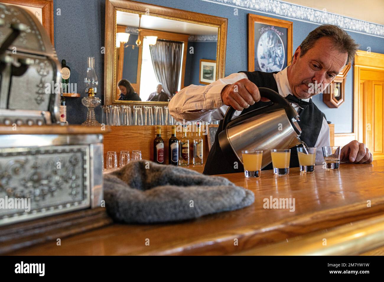 BARMAN AT THE CHATEAU ALBERT HOTEL BUILT IN 1907, HISTORIC ACADIAN ...