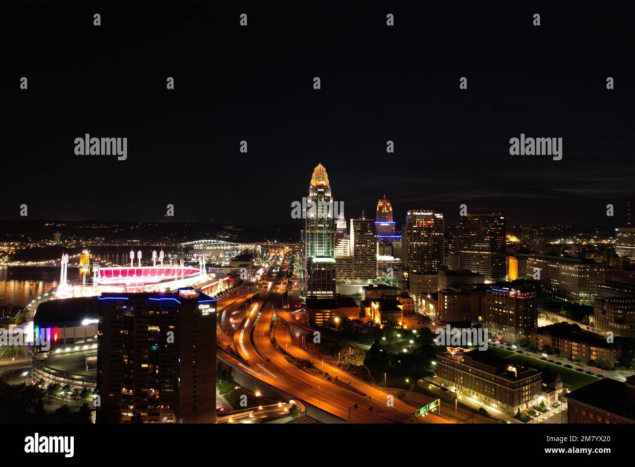 An aerial view of Cincinnati downtown in Ohio, at night, with glowing ...