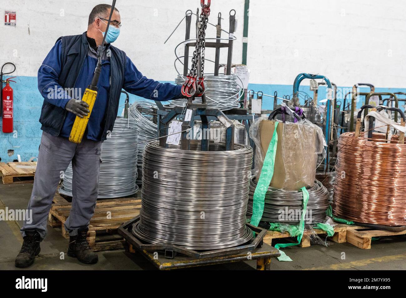 WORKER STOCKING SPOOLS OF WIRE, CALISTE-MARQUIS COMPANY SPECIALIZING IN ...