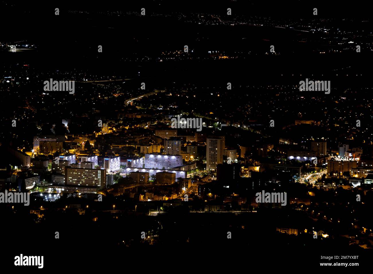 An aerial shot of the small town with buildings at night Stock Photo ...
