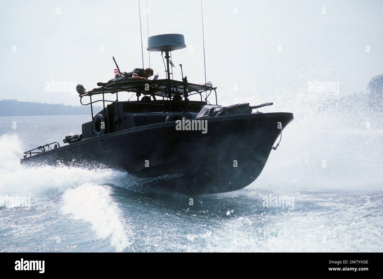 A starboard bow view of a PBR Mark II river patrol boat underway during ...
