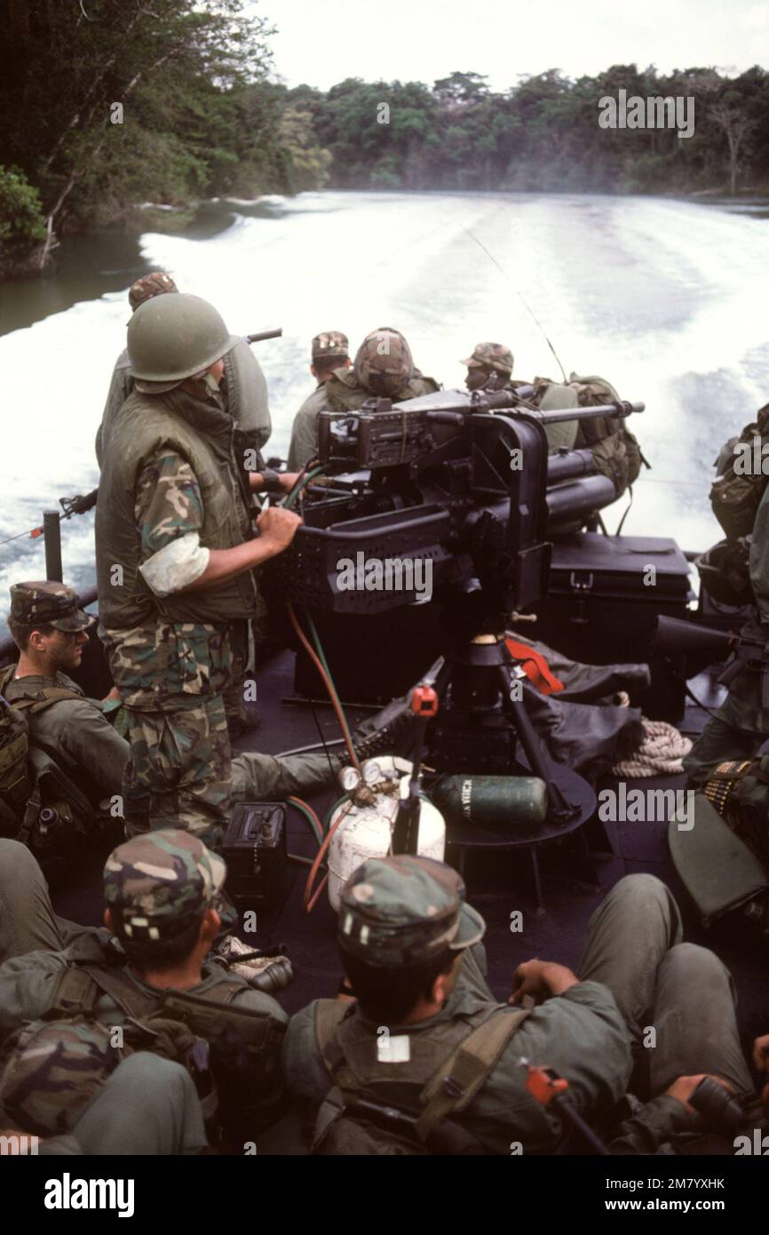 A group of United States Army Rangers relax on the stern of an inshore ...