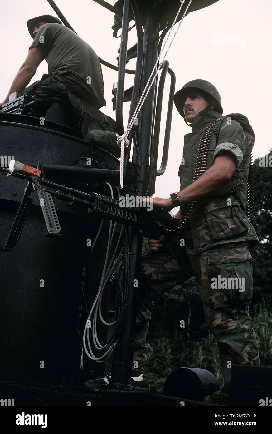 Crewmembers aboard an inshore patrol craft, from the Combat Harbor ...