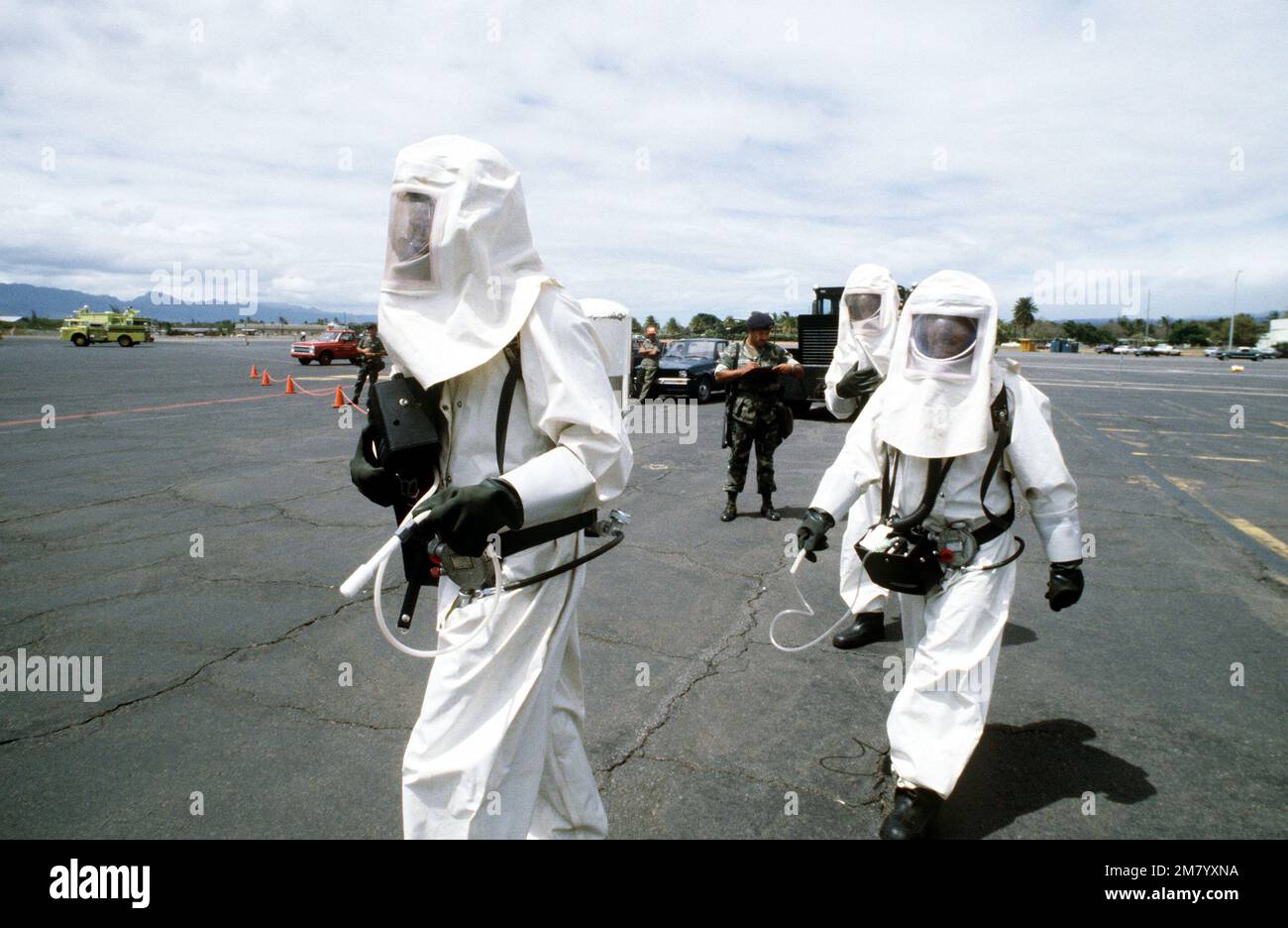 Bio-environmental personnel, equipped with special suits provided by ...