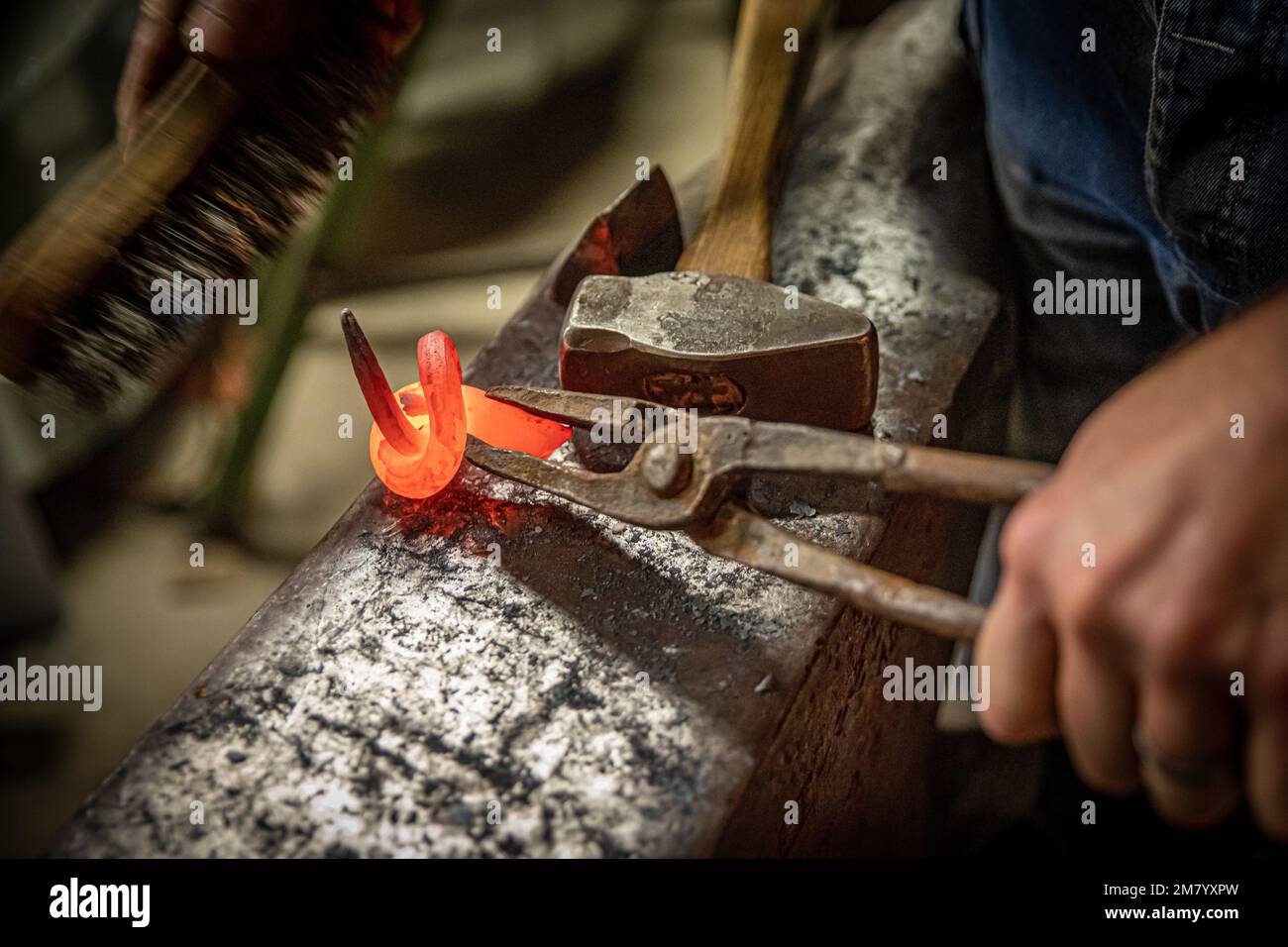 STEEL COMING OUT OF THE FORGE FOR FASHIONING, THE ART OF WORKING THE ...