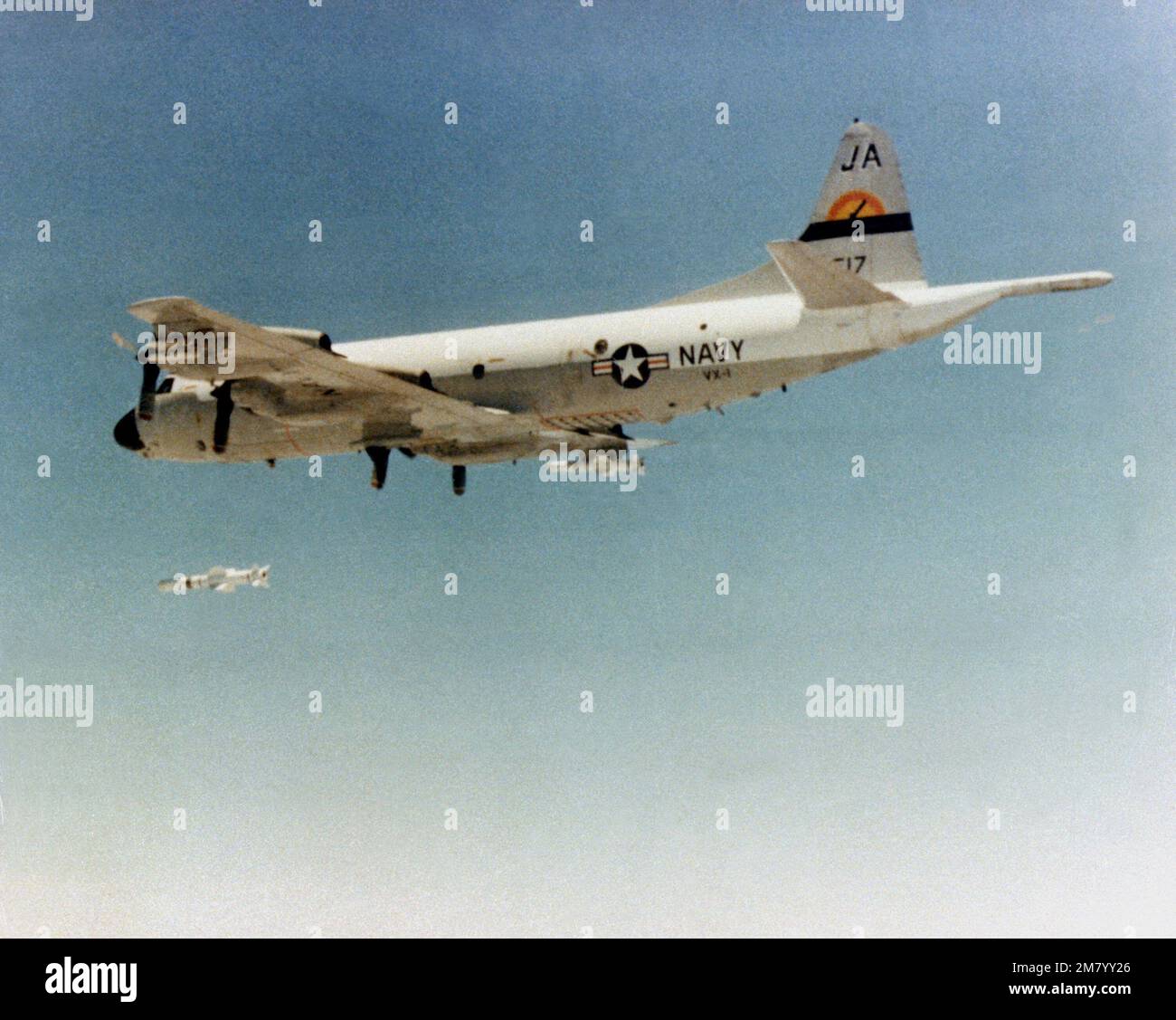 An air-to-air left side view of a P-3 Orion aircraft immediately after ...