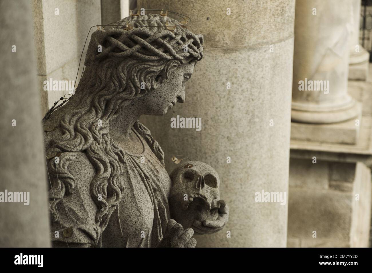 The ancient statue holding the skull in church in Portugal, Porto Stock ...