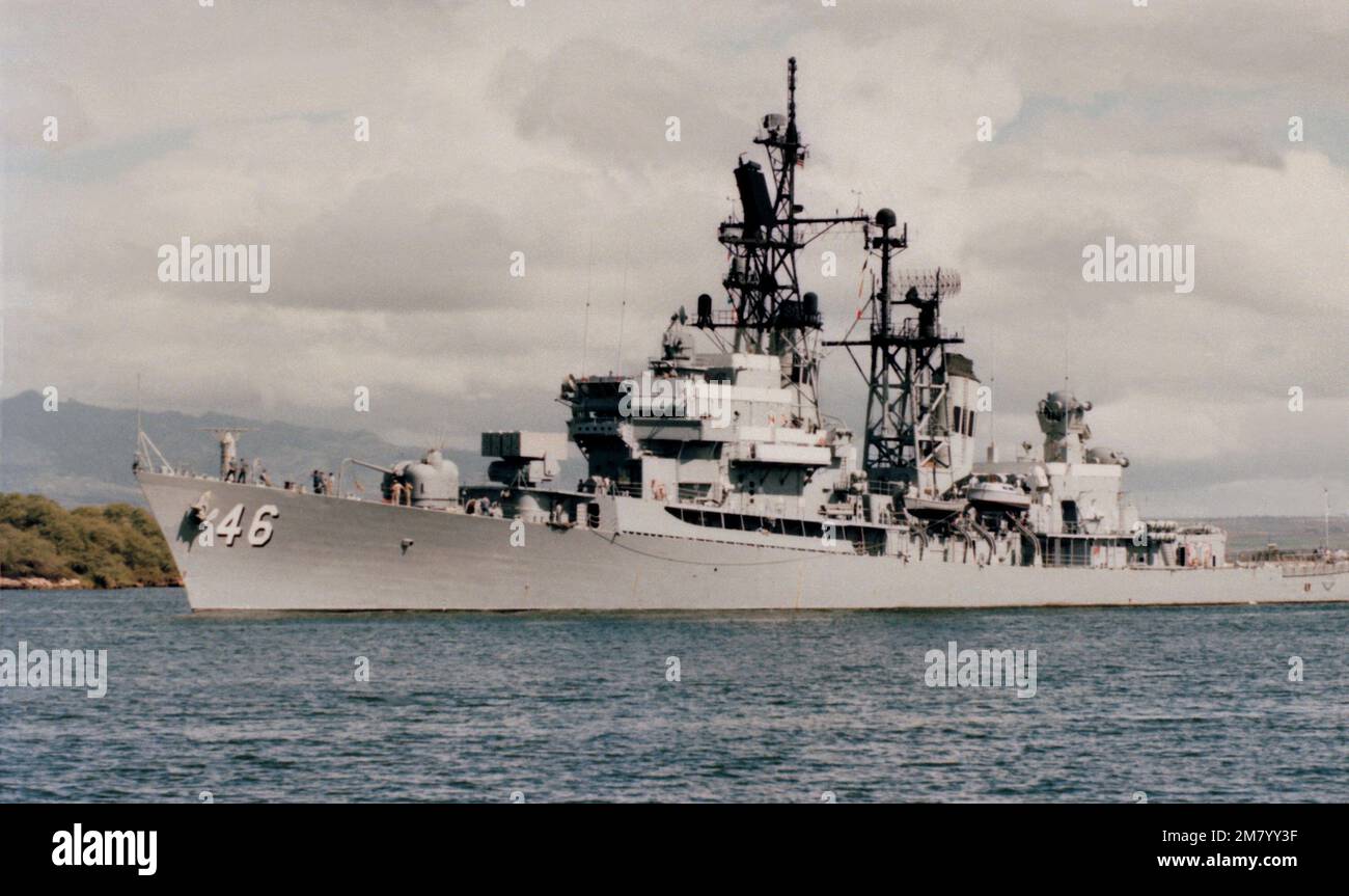 A port side view of the Coontz class guided missile destroyer USS ...
