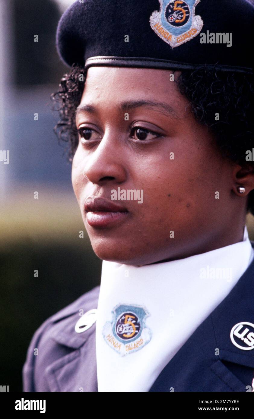 A member of the 475th Air Base Wing Honor Guard stands at attention ...