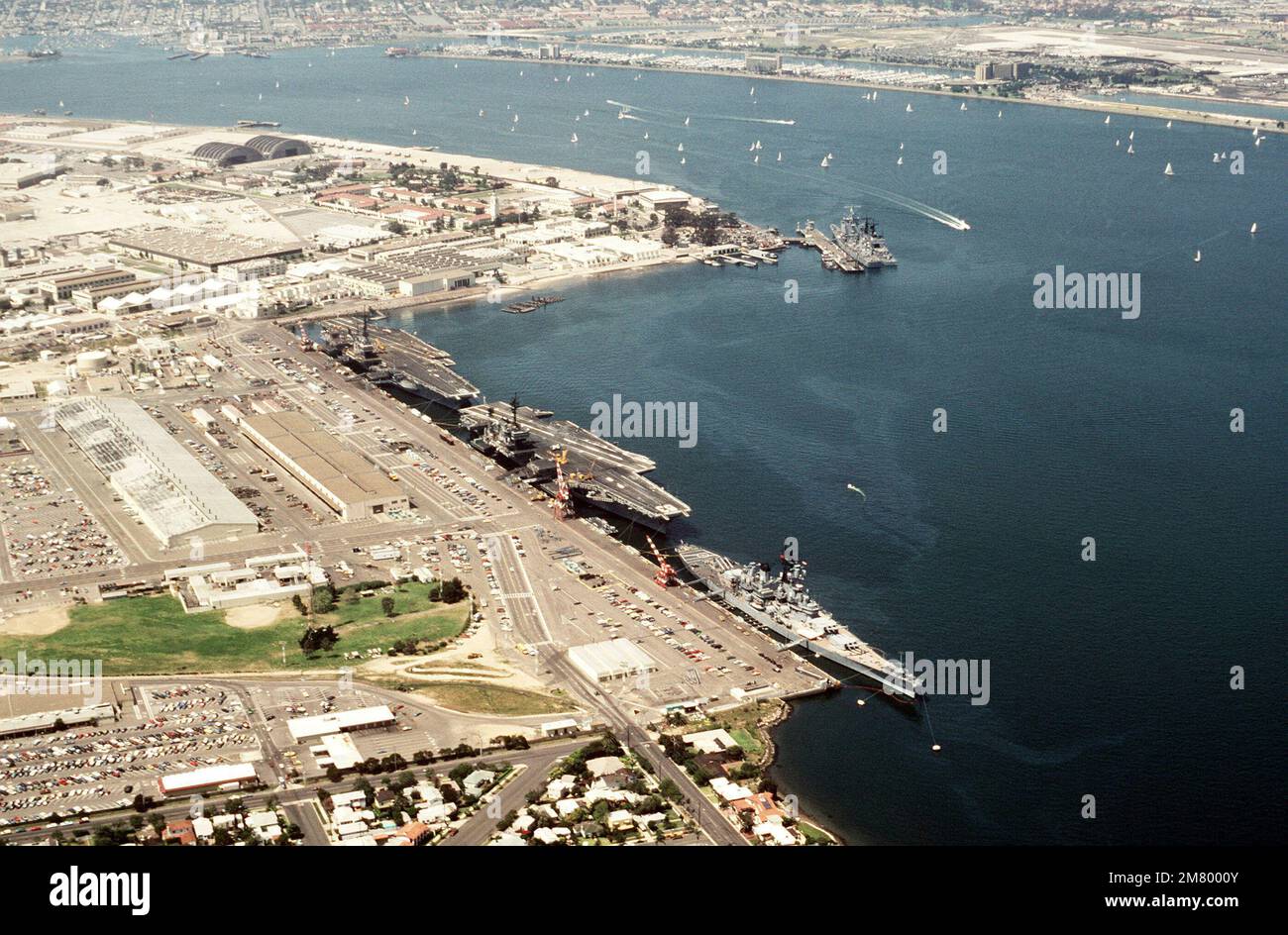 Aerial view of US Navy ships docked at the naval station. They are ...