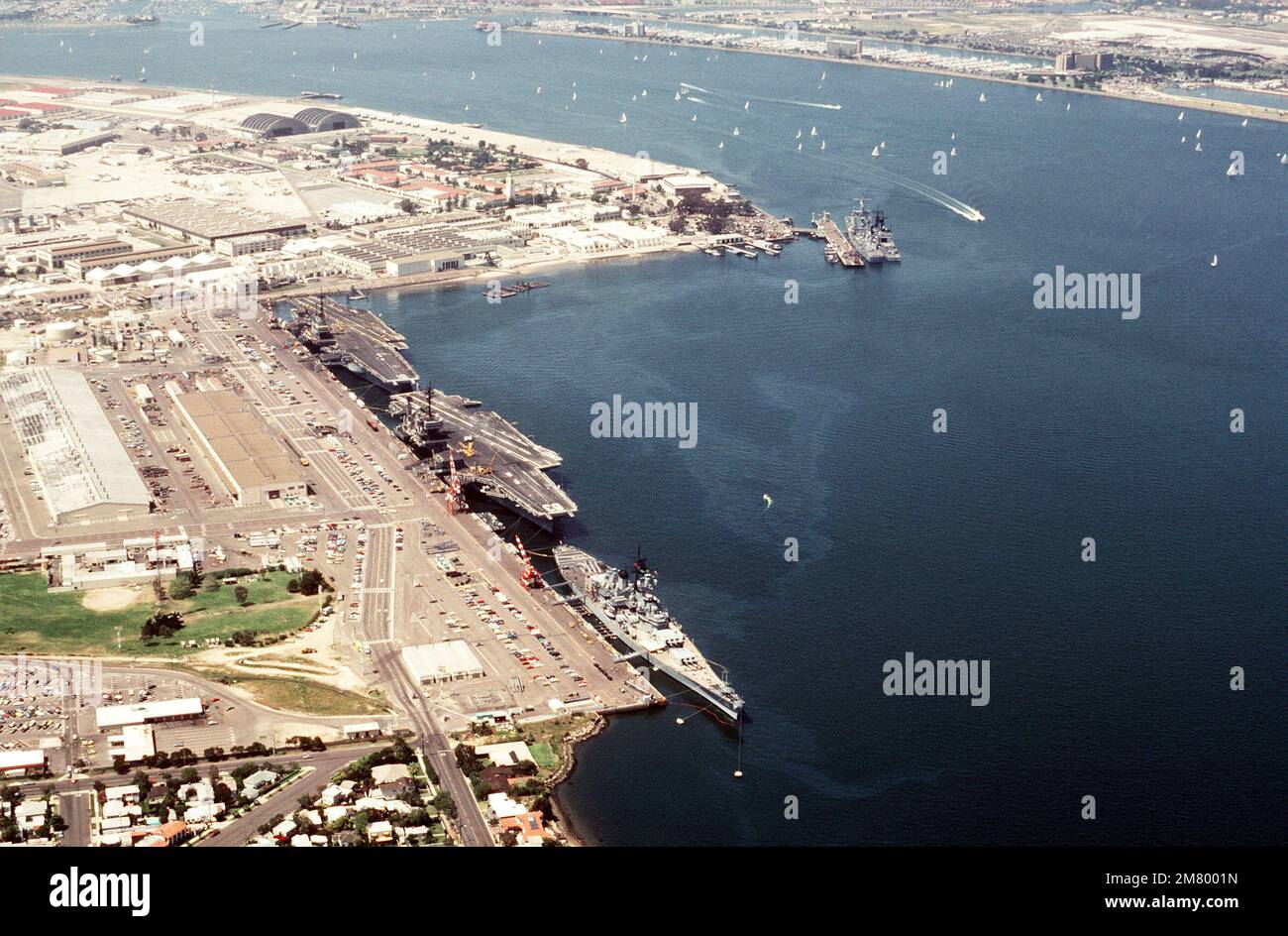 Aerial view of US Navy ships docked at the naval station. They are ...