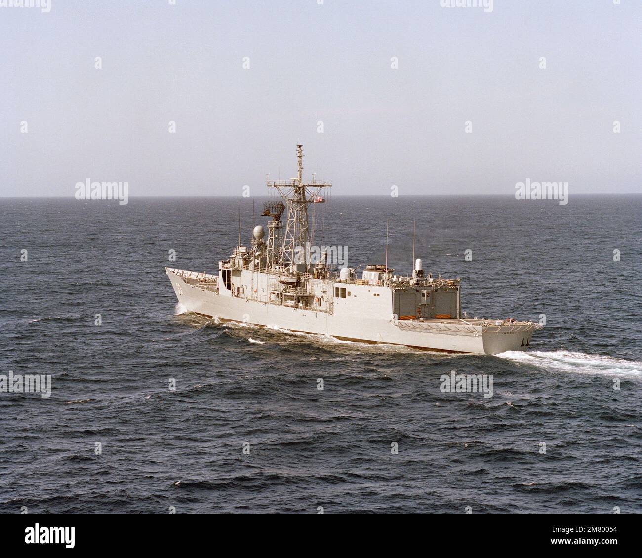 An aerial port quarter view of the guided missile frigate USS JARRETT ...