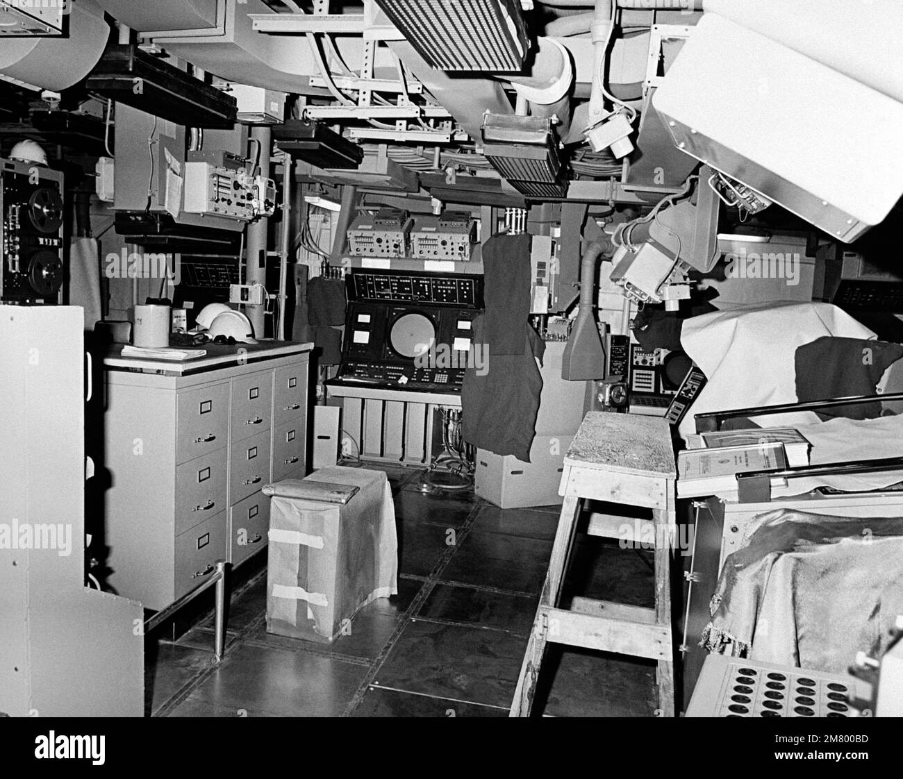 An interior view of the combat information center on the guided missile ...