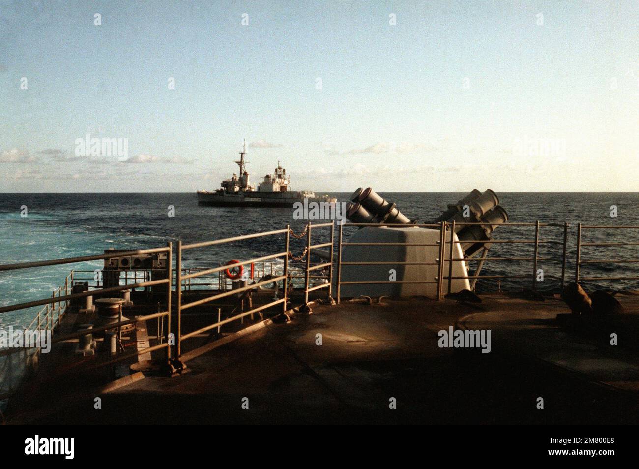 Two Harpoon missile launchers and a 5-inch DP Mark-45 gun mounted on ...