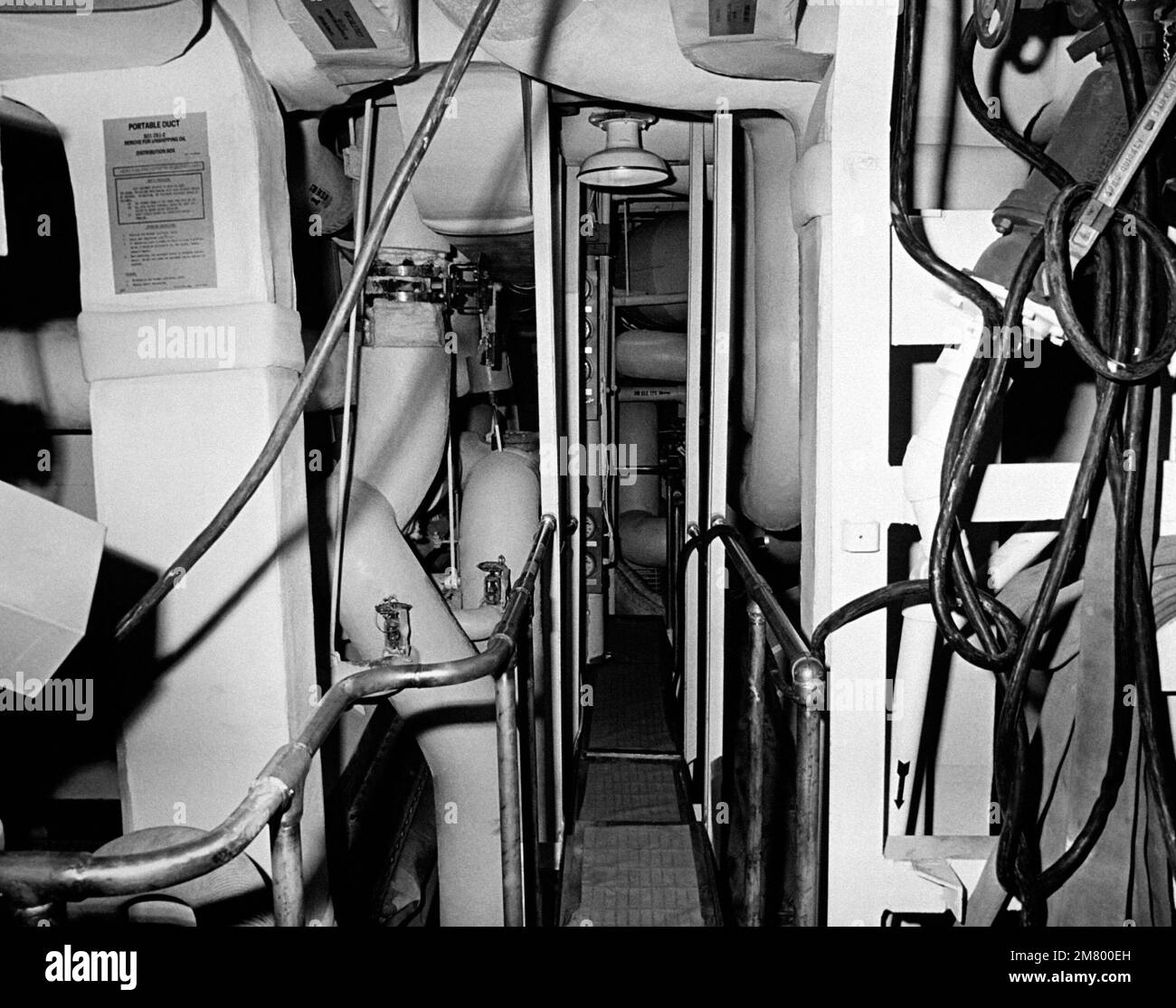 An interior view of the engine room on the guided missile frigate USS ...