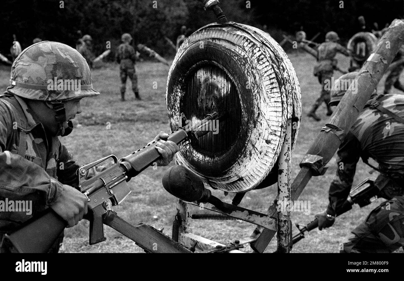 Private Mark Hunt of Company C, 2nd Battalion, 47th Infantry, thrusts ...
