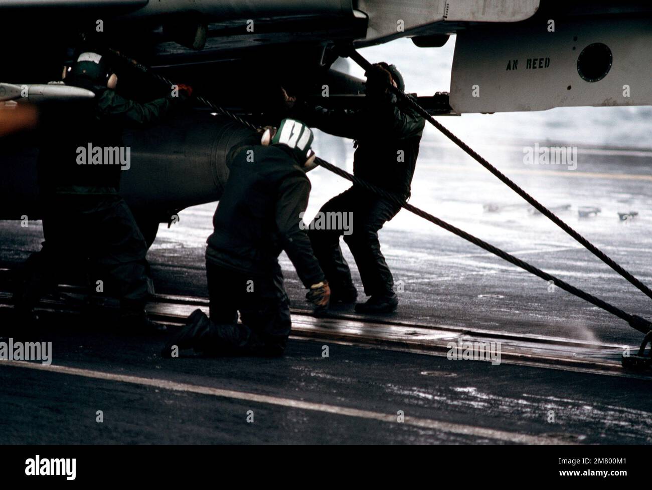 Members of a catapult crew aboard the aircraft carrier USS MIDWAY (CV ...