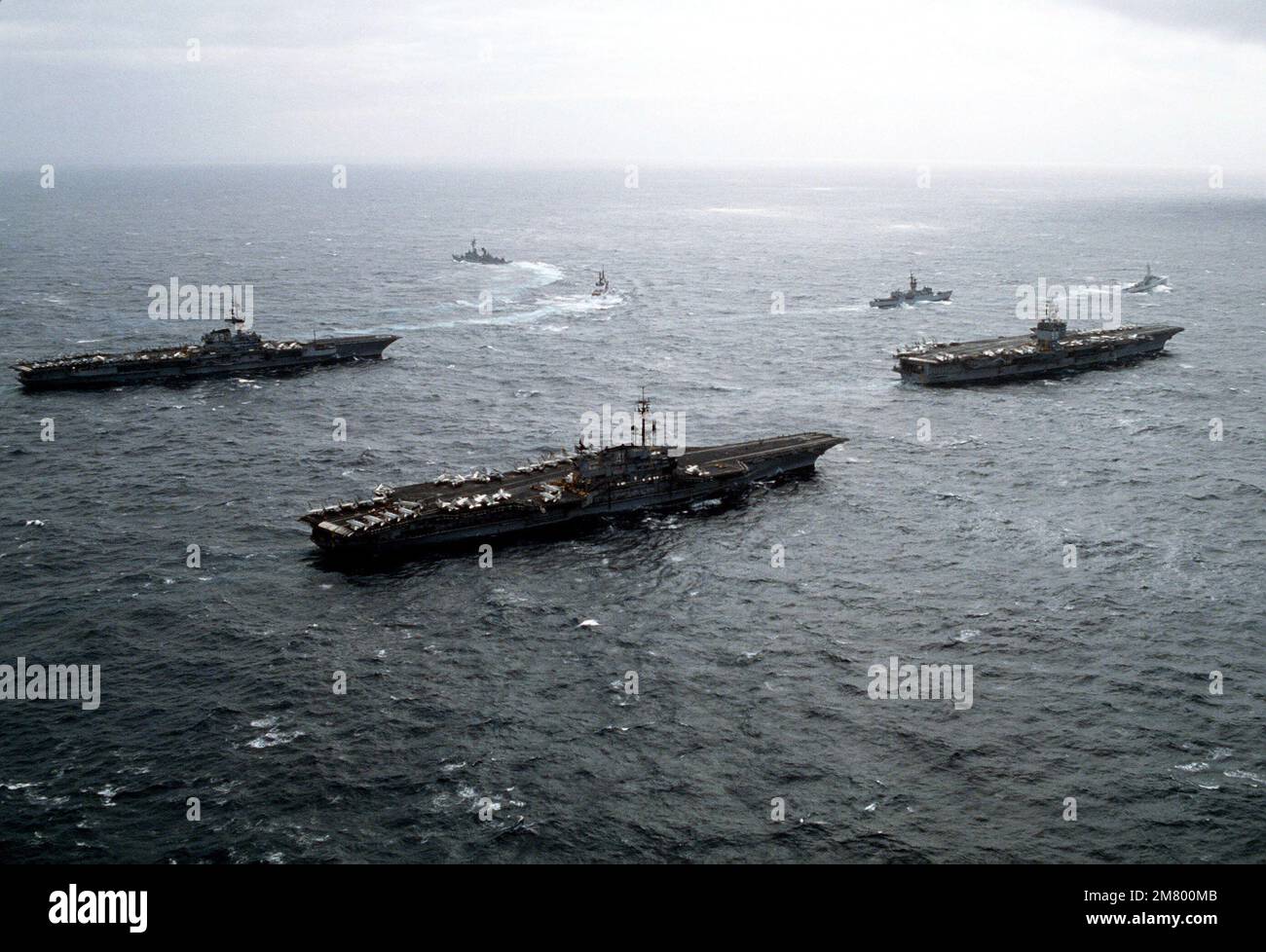 A starboard quarter view of the aircraft carriers USS CORAL SEA (CV 43 ...