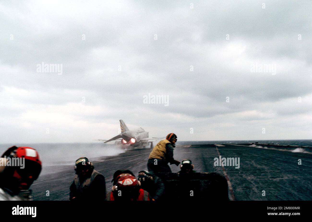 An F-4 Phantom II aircraft takes off from the flight deck of the ...