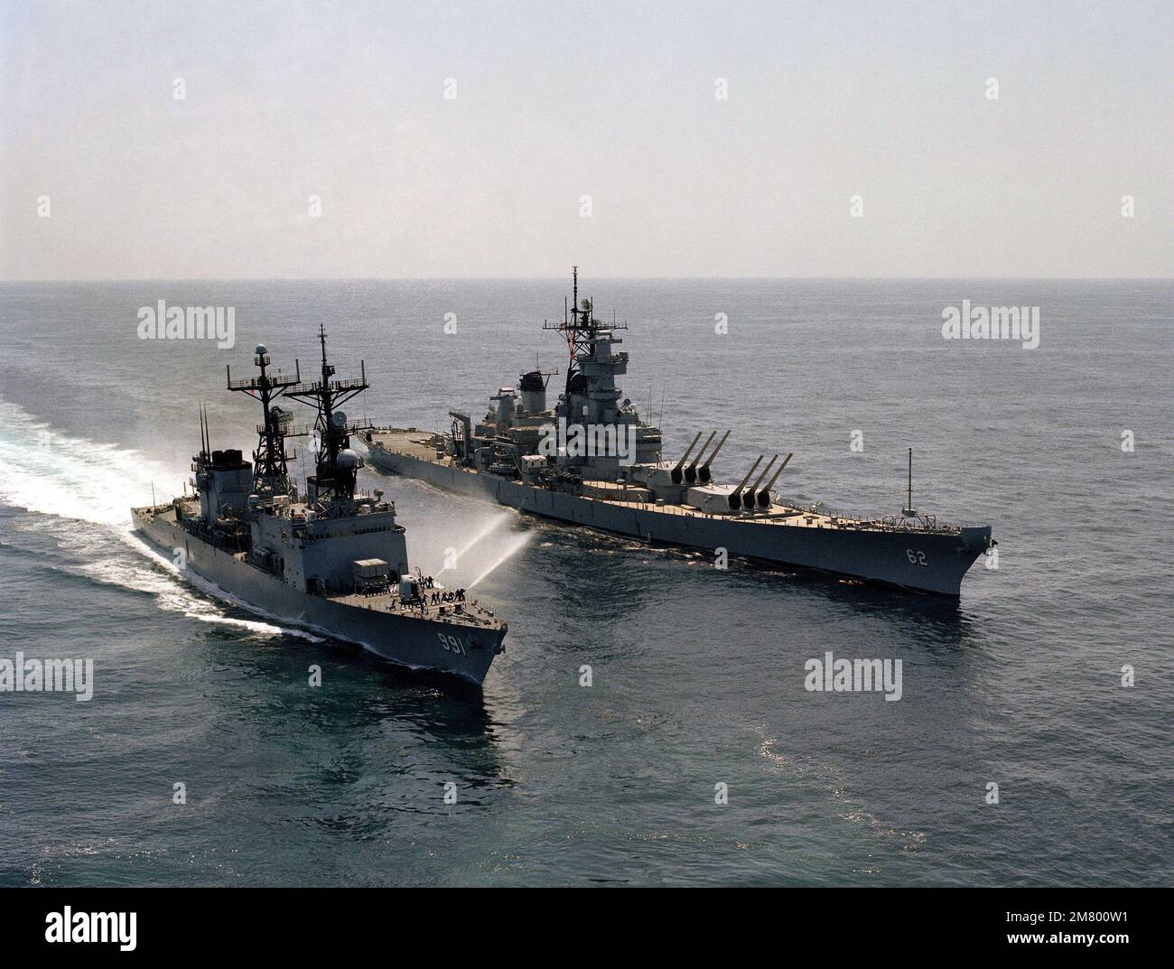 Aerial starboard bow view of the destroyer USS FIFE (DD 991), left, and ...