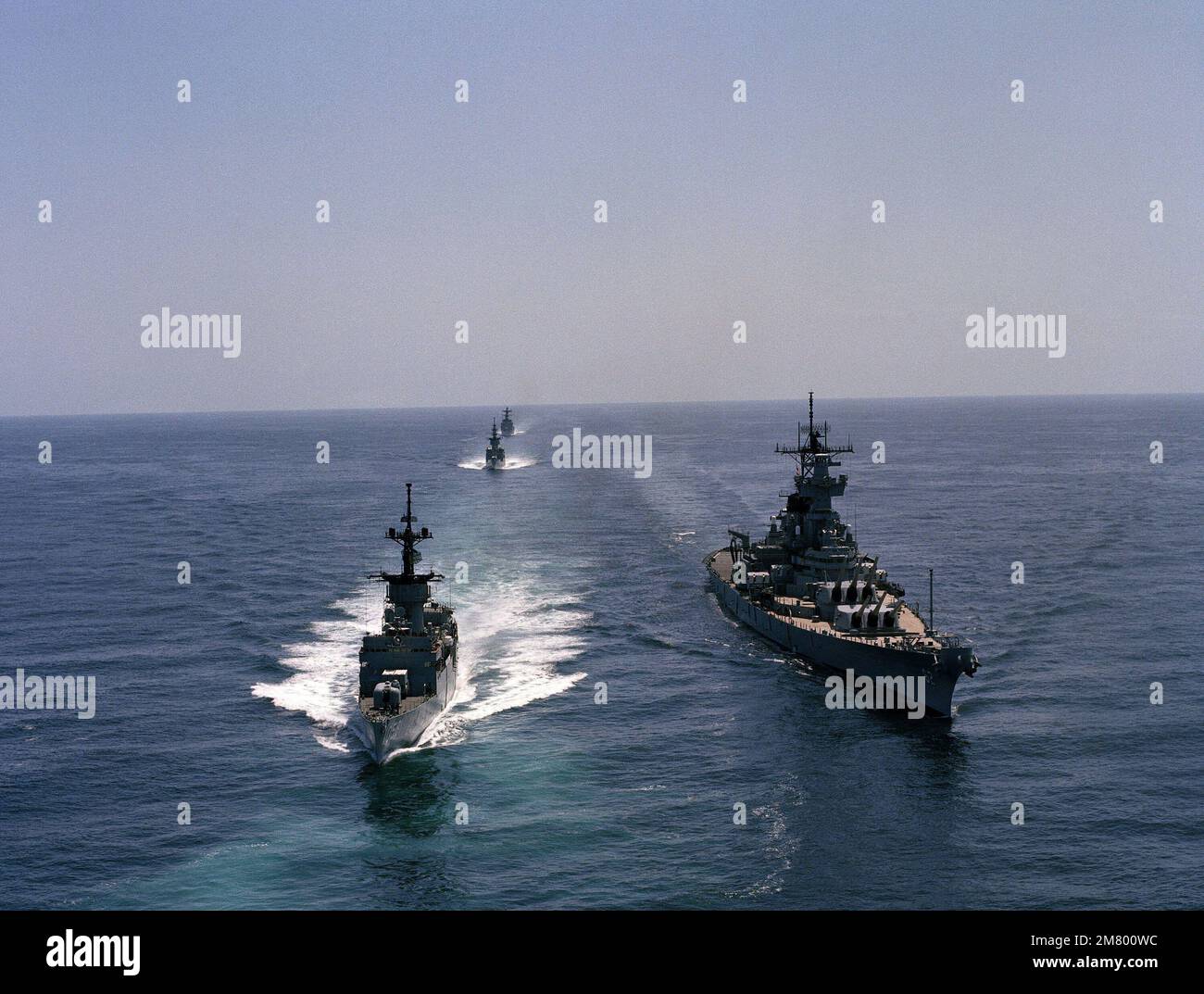 Aerial starboard bow view of the battleship USS NEW JERSEY (BB 62 ...