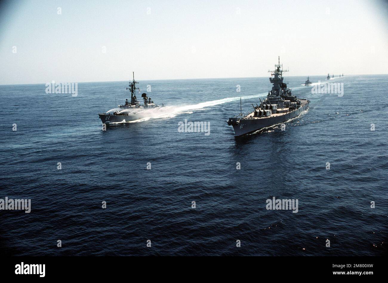 Aerial port bow view of the battleship USS NEW JERSEY (BB-62), (right ...