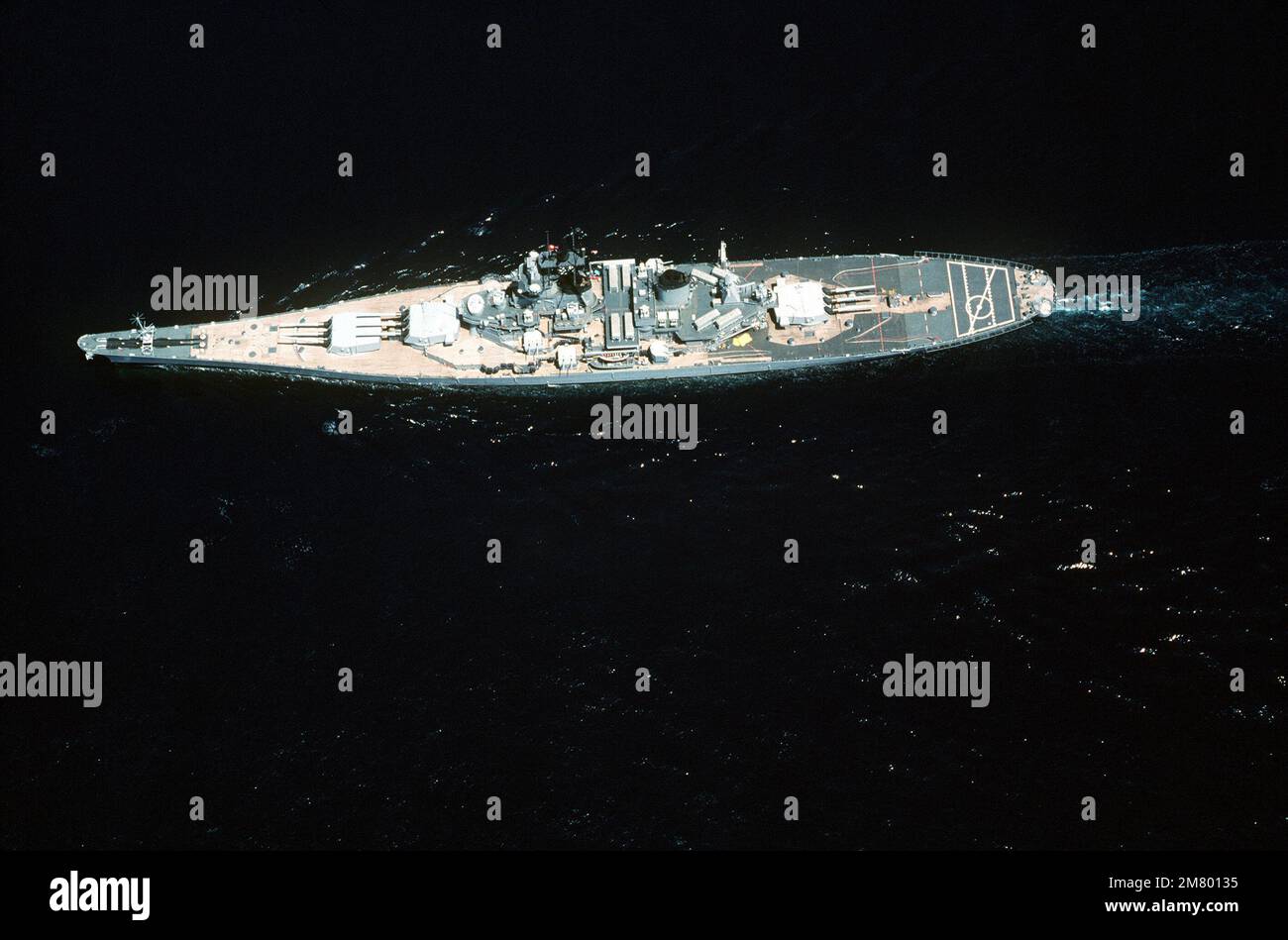 A vertical view of the battleship USS NEW JERSEY (BB-62) underway ...