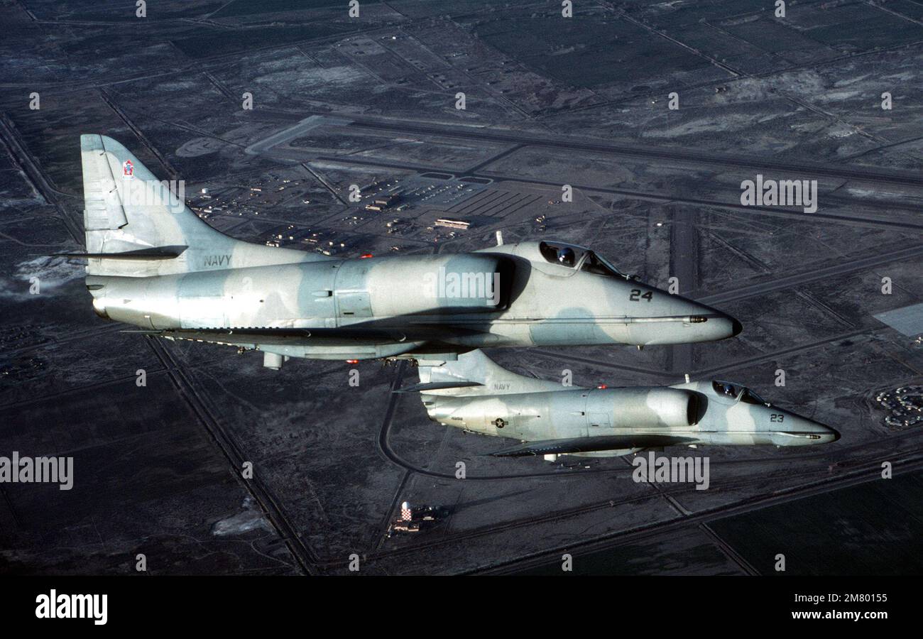 An air-to-air right side view of two A-4E Skyhawk aircraft from Carrier ...