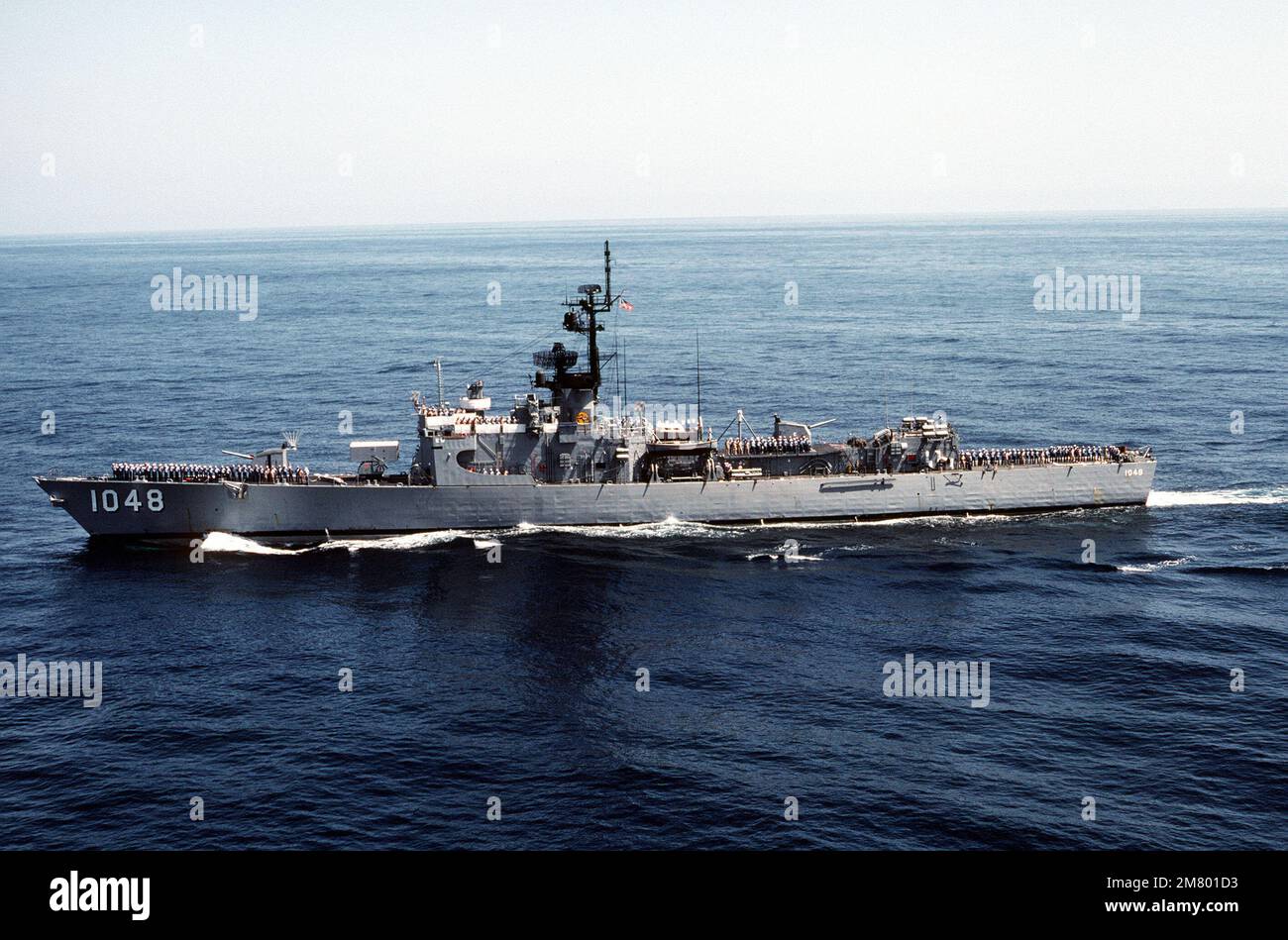 Aerial port beam view of the frigate USS SAMPLE (FF-1048) underway ...