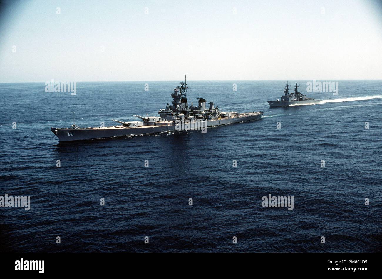 Aerial port bow view of the battleship USS NEW JERSEY (BB-62) (front ...