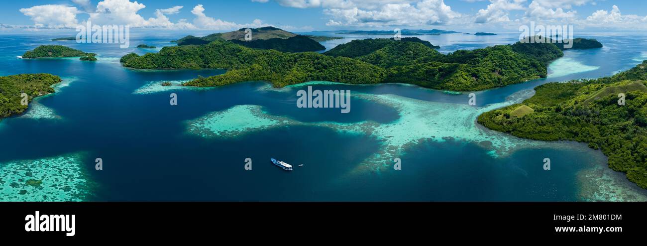 Extensive coral reefs fringe rainforest-covered islands in the Solomon ...