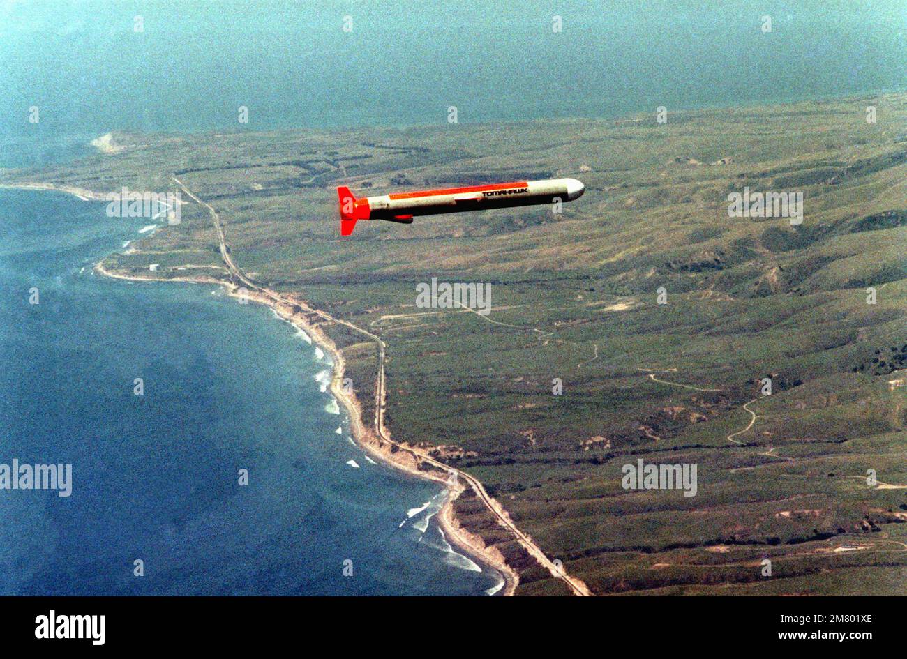 An air-to-air right view of a Tomahawk submarine-launched cruise ...