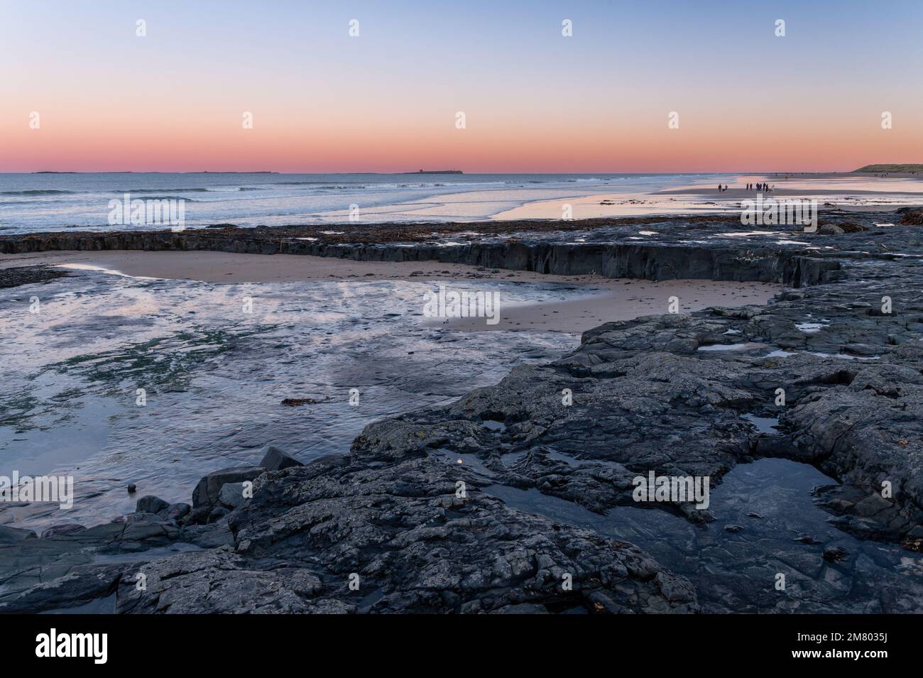 Sunset at Bamburgh beach, Northumberland, UK Stock Photo - Alamy