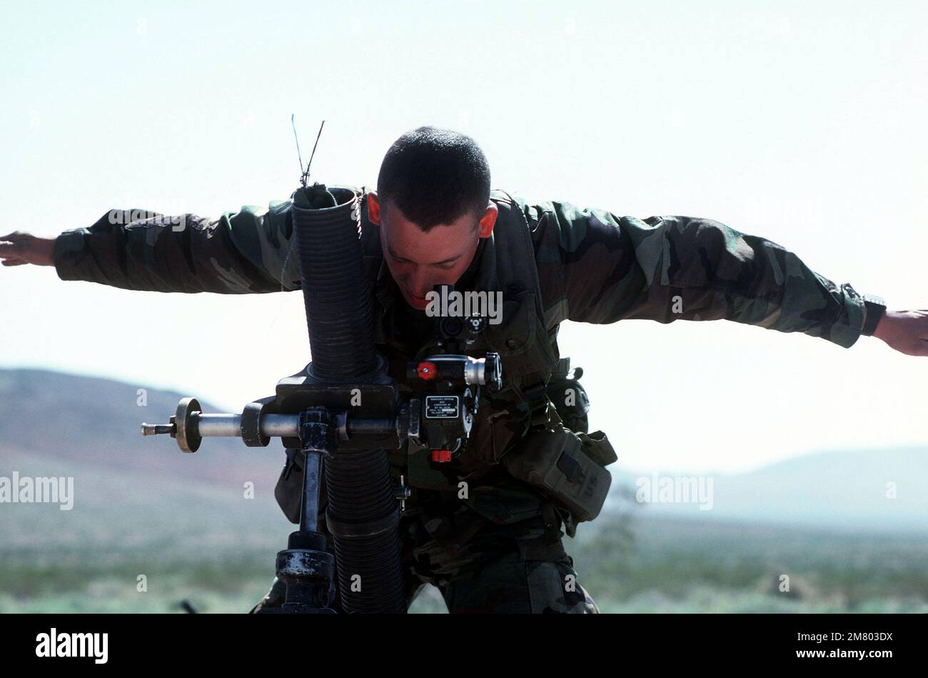 An airman sights in an M29 81 mm mortar during Exercise CROWN DEFENDER ...