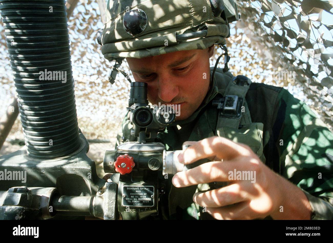 An airman sights in an M29 81 mm mortar during Exercise CROWN DEFENDER ...