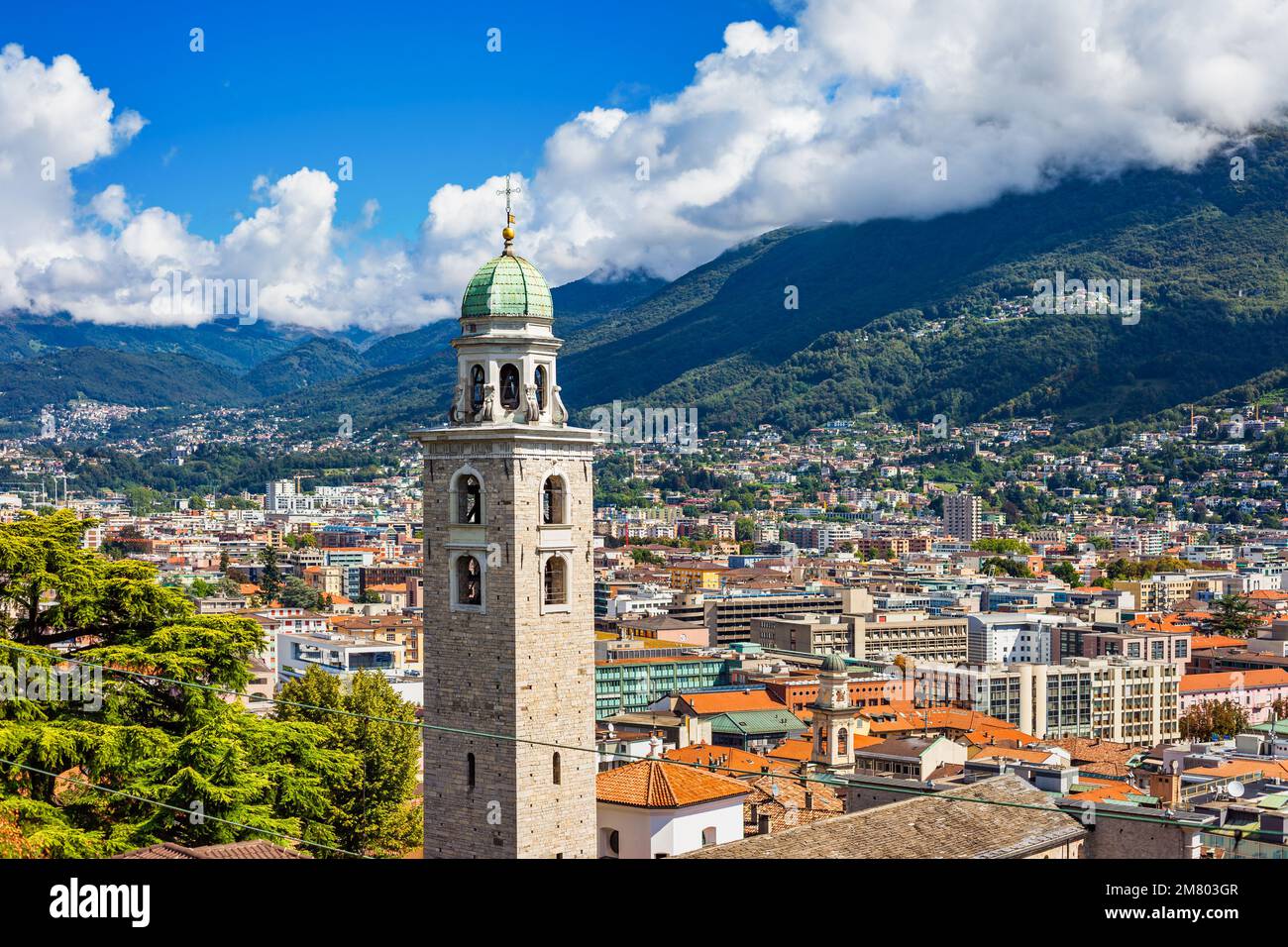 Cityscape of Lugano with the Cathedral of Lugano in the foreground ...